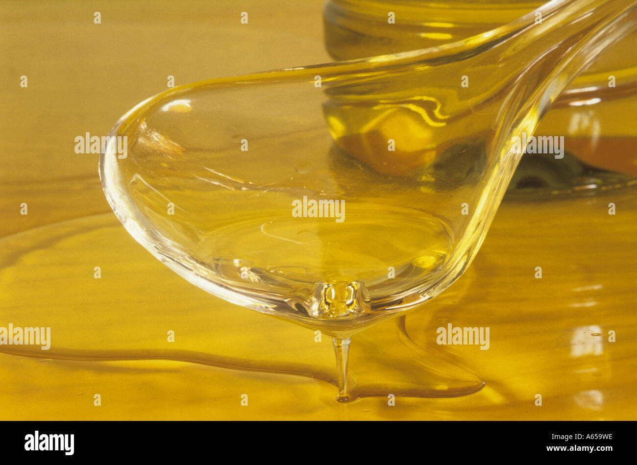 Spoon and oil Stock Photo - Alamy