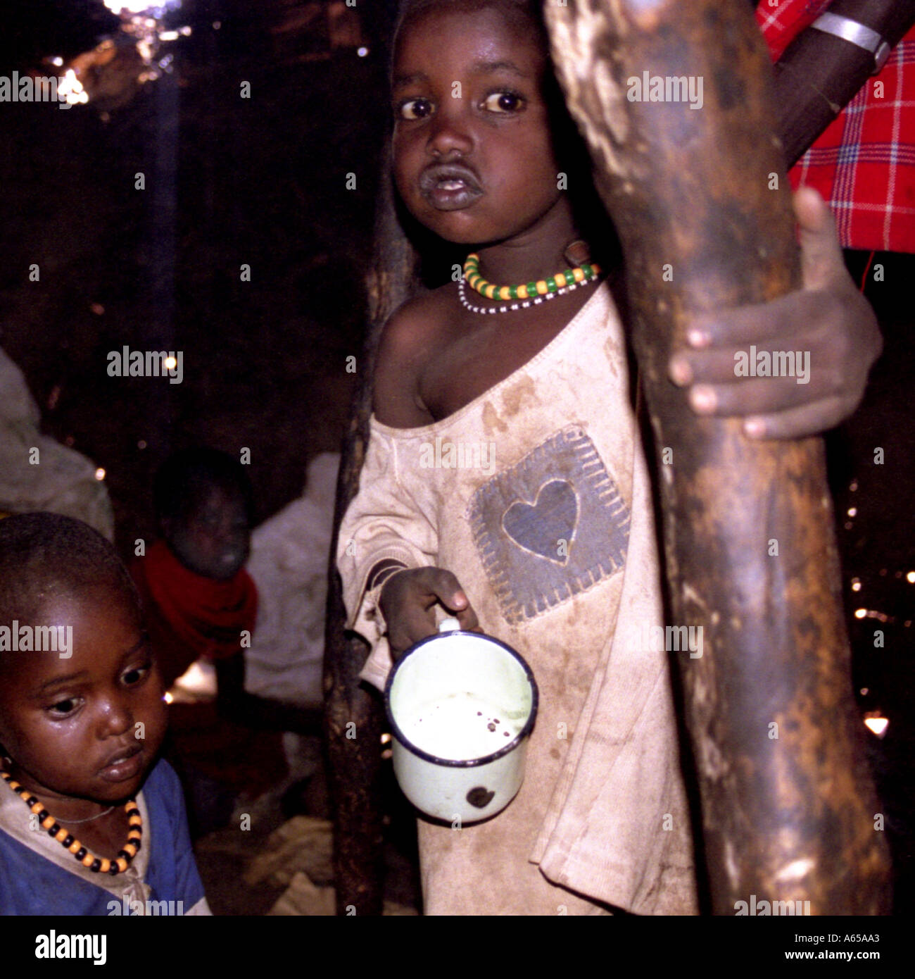 Kenyan Boy with Cup Stock Photo - Alamy
