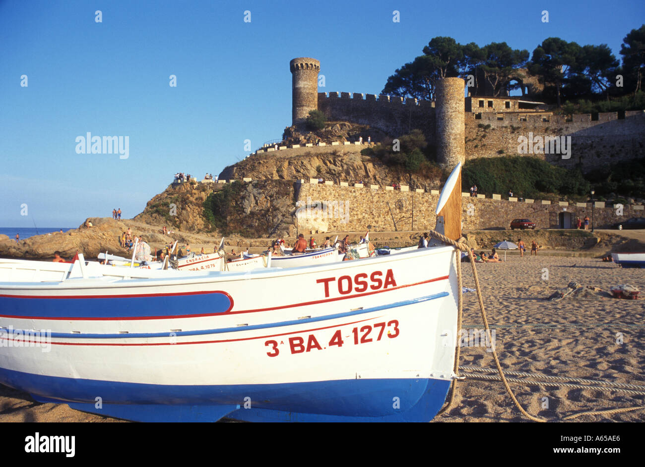 Boat on beach at Tossa de Mar, Costa Brava, Spain Stock Photo - Alamy