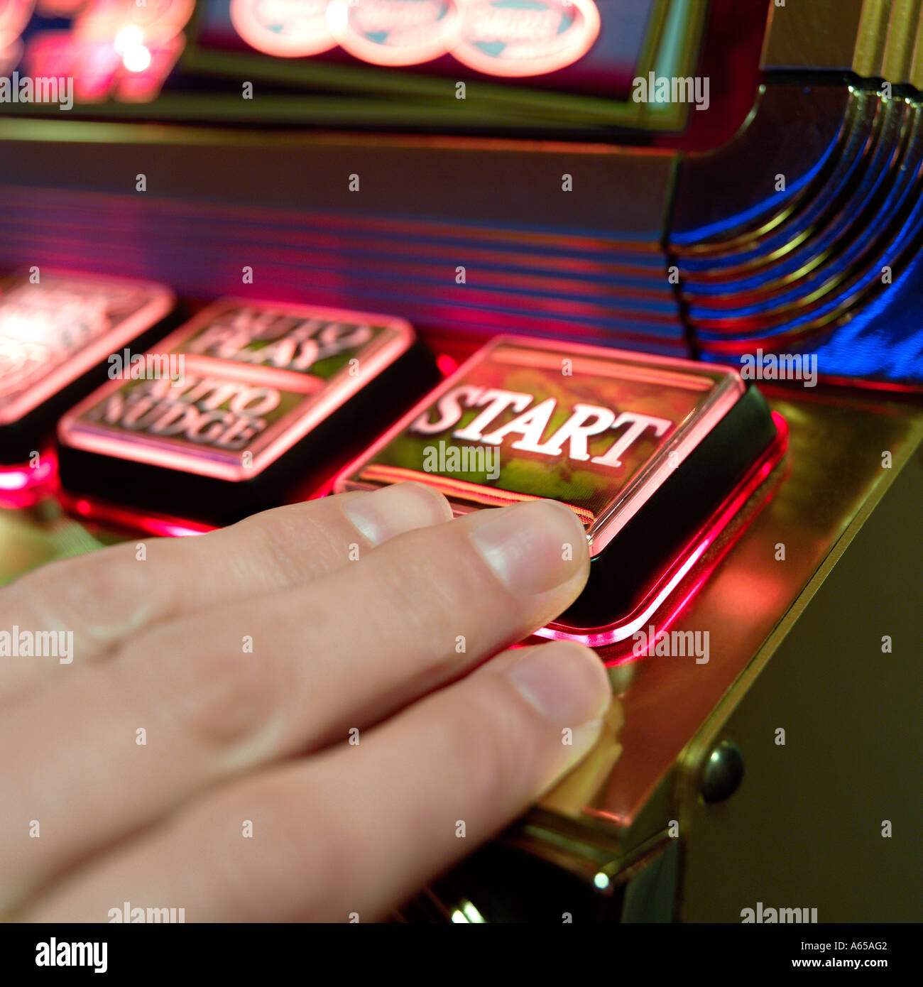 Hand on Start button Stock Photo - Alamy