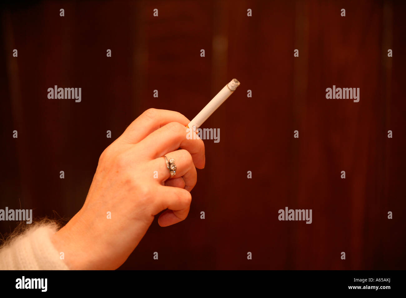 Woman smoking cigarette, close up Stock Photo - Alamy
