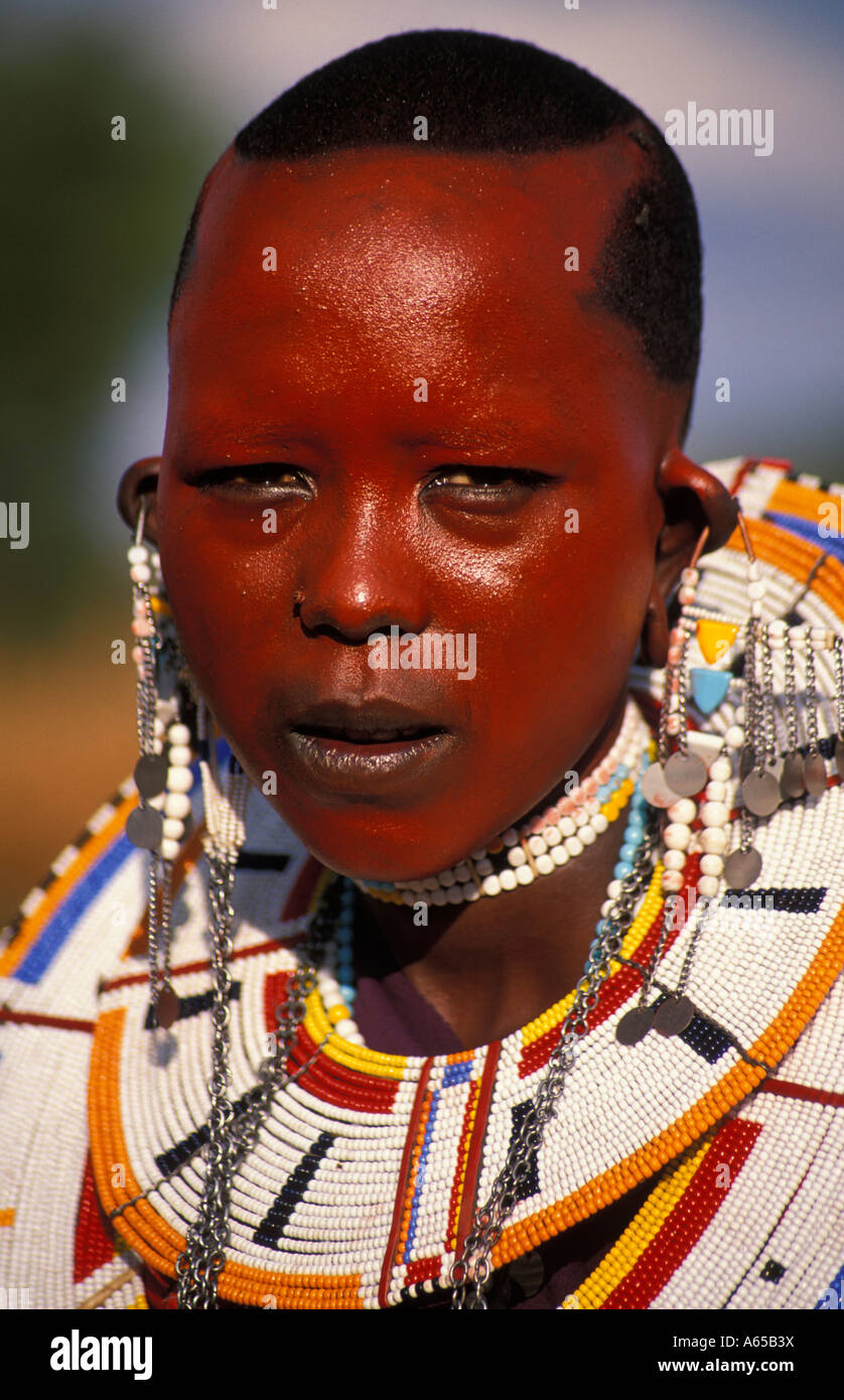Maasai woman with ochre painted face and elaborate beadwork Longido ...