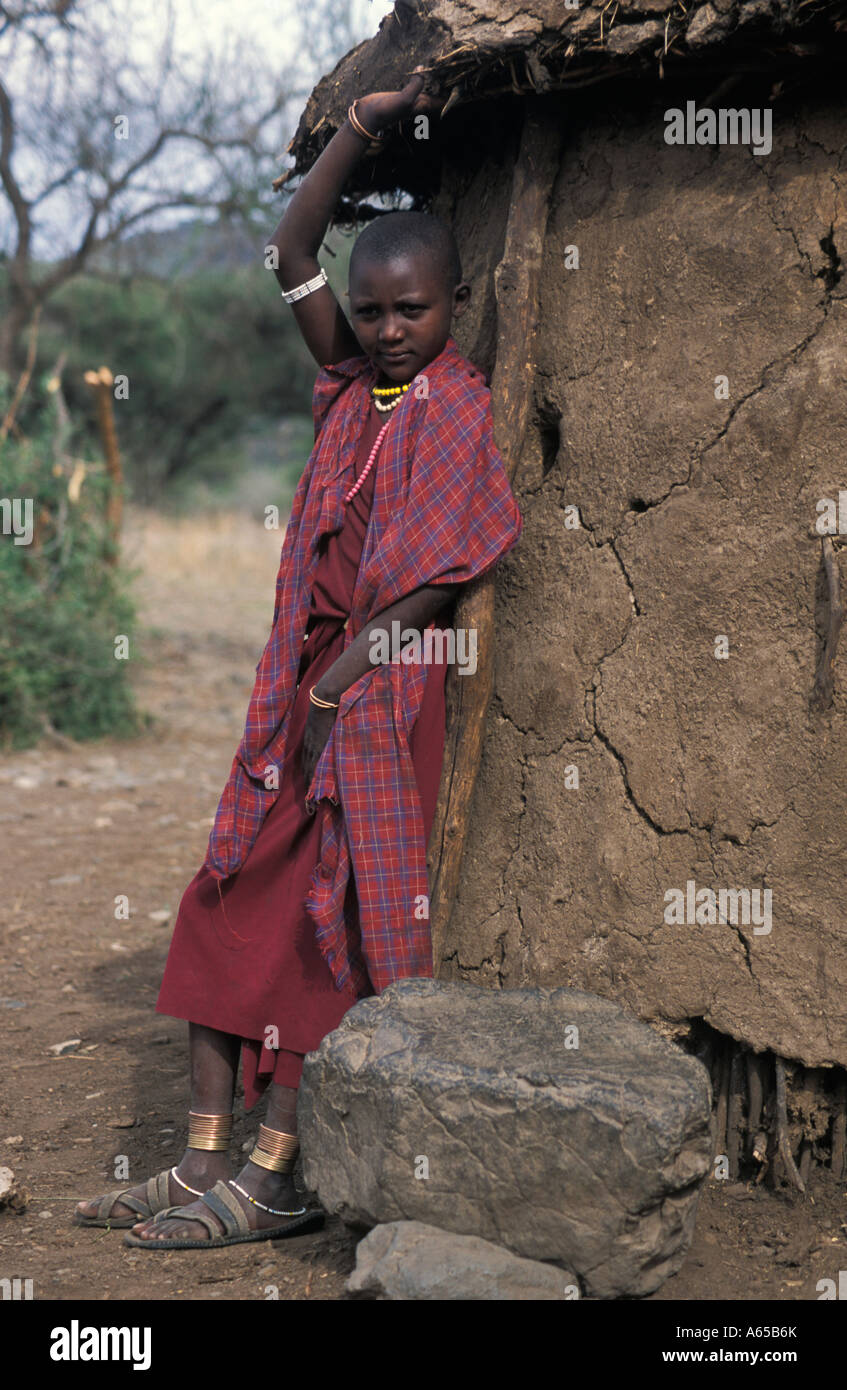 Maasai girl standing at a traditional homestead Tanzania Stock Photo ...