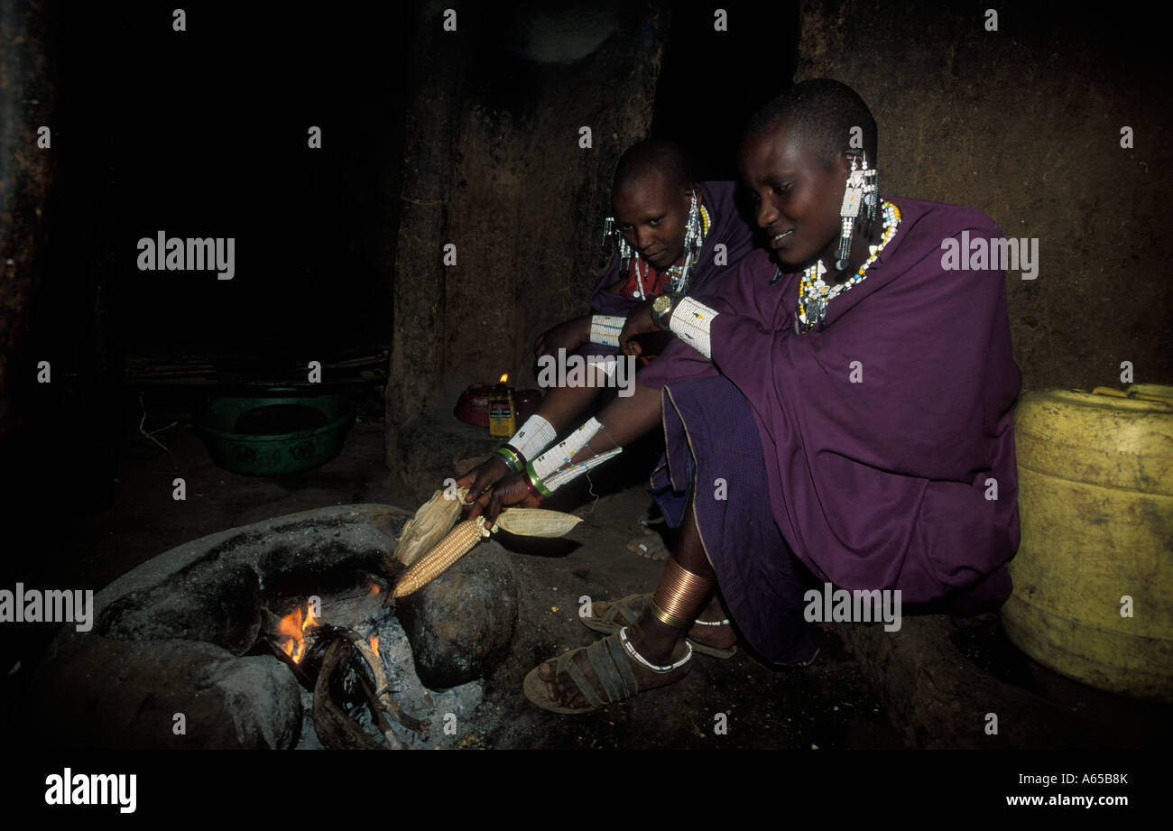 Maasai women cooking maize inside a traditional homestead Longido ...