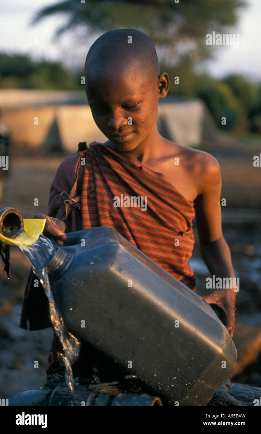 Maasai child collecting water Tanzania Stock Photo - Alamy
