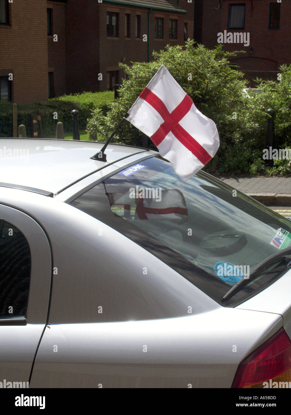 Cross of St George a Flag close up mounted on rear end of silver roof ...