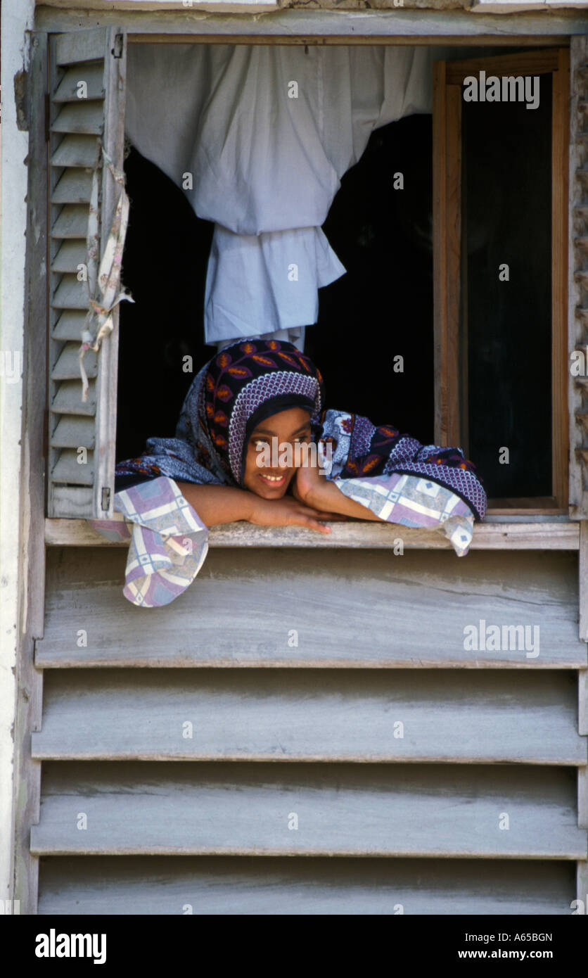 Swahili girl looking out of her window Stone Town Zanzibar Tanzania ...