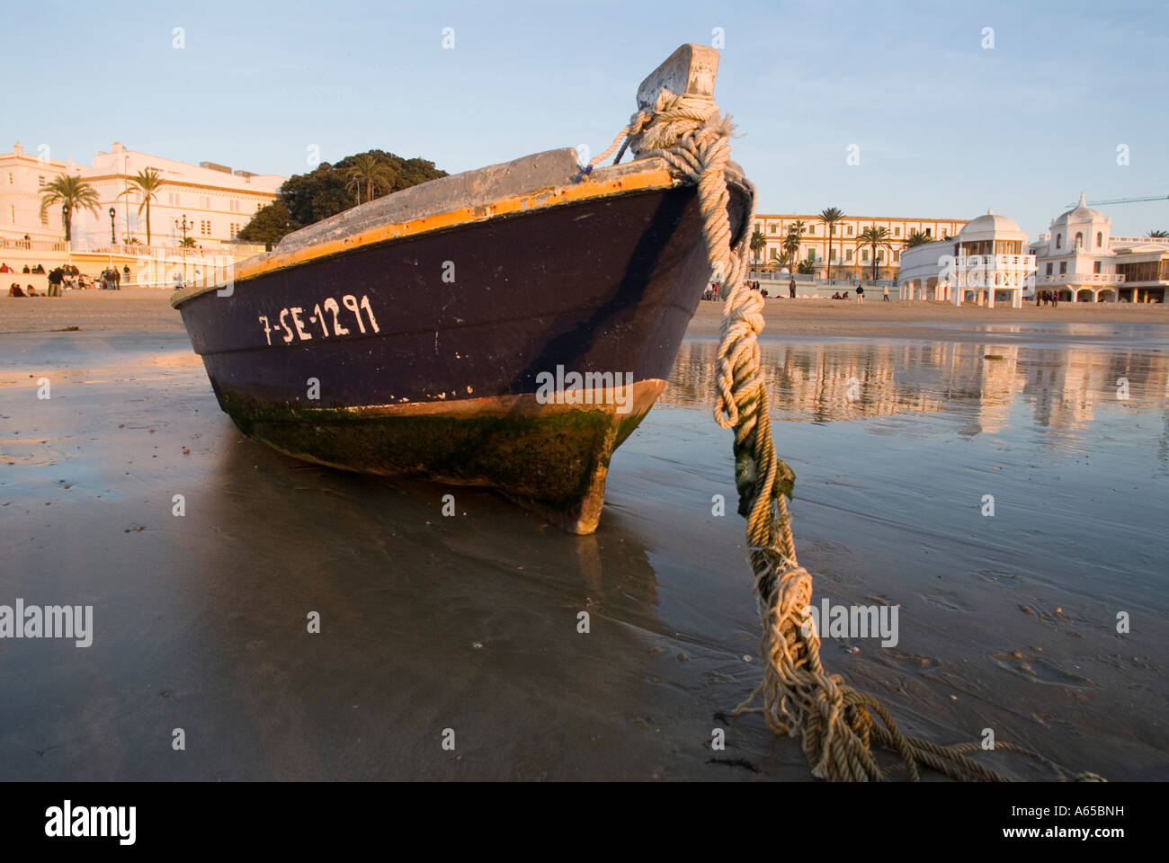 Rowboat tied up on the beach, Cadiz, Spain Stock Photo - Alamy