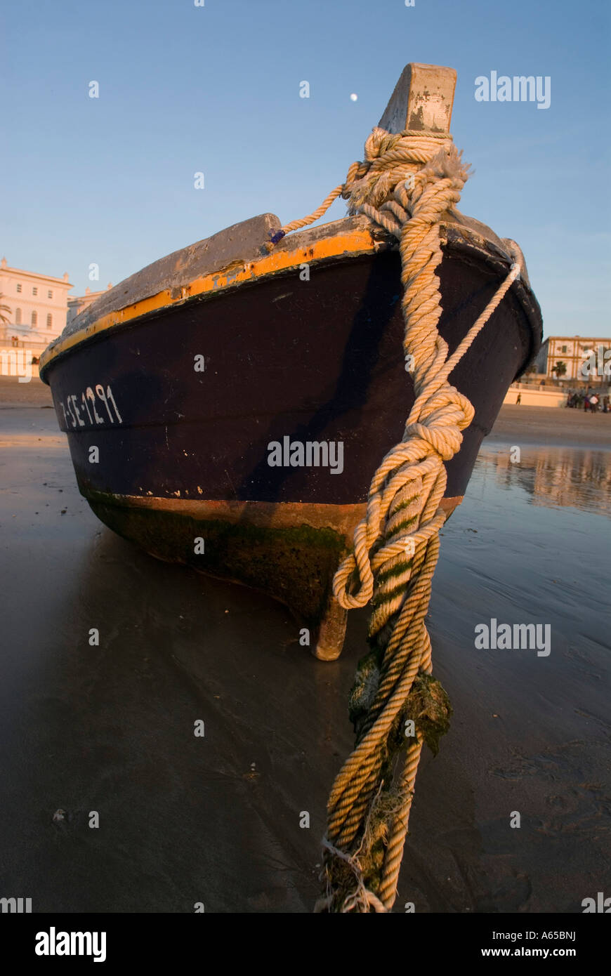 Rowboat tied up on the beach, Cadiz, Spain Stock Photo - Alamy