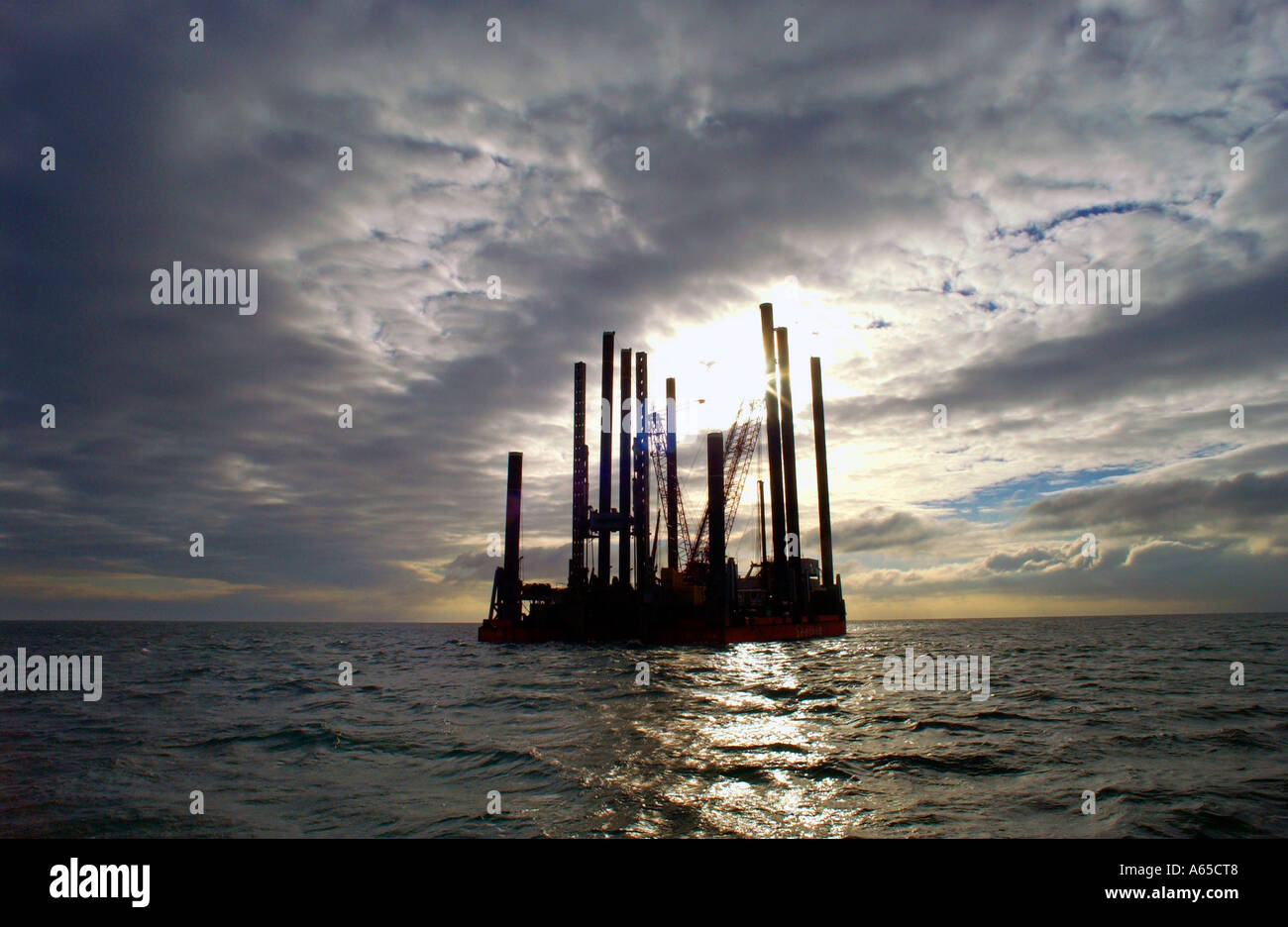 A drill rig off the south coast of england, surveying the sea bed for a ...