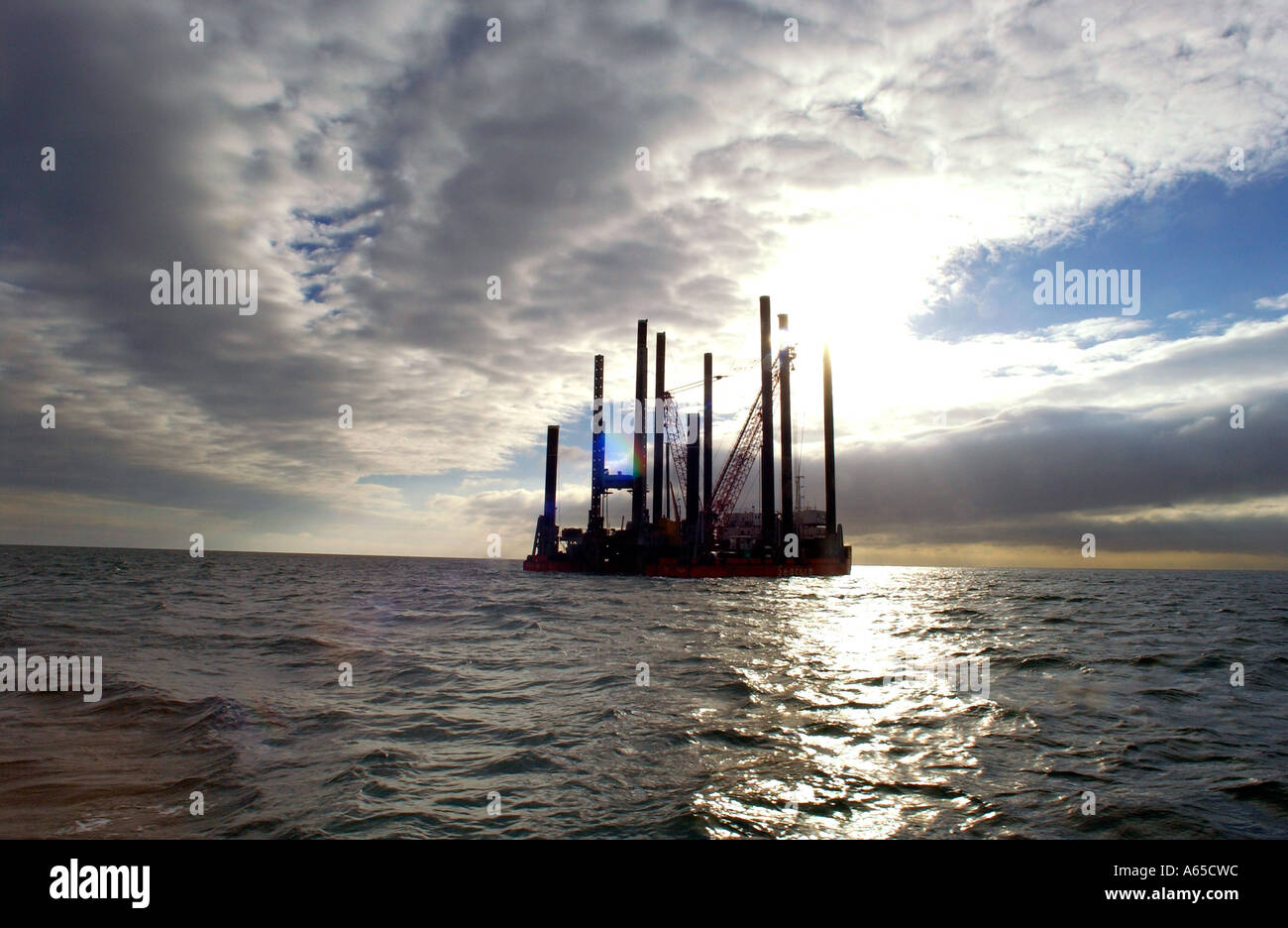 A drill rig off the south coast of england, surveying the sea bed for a ...