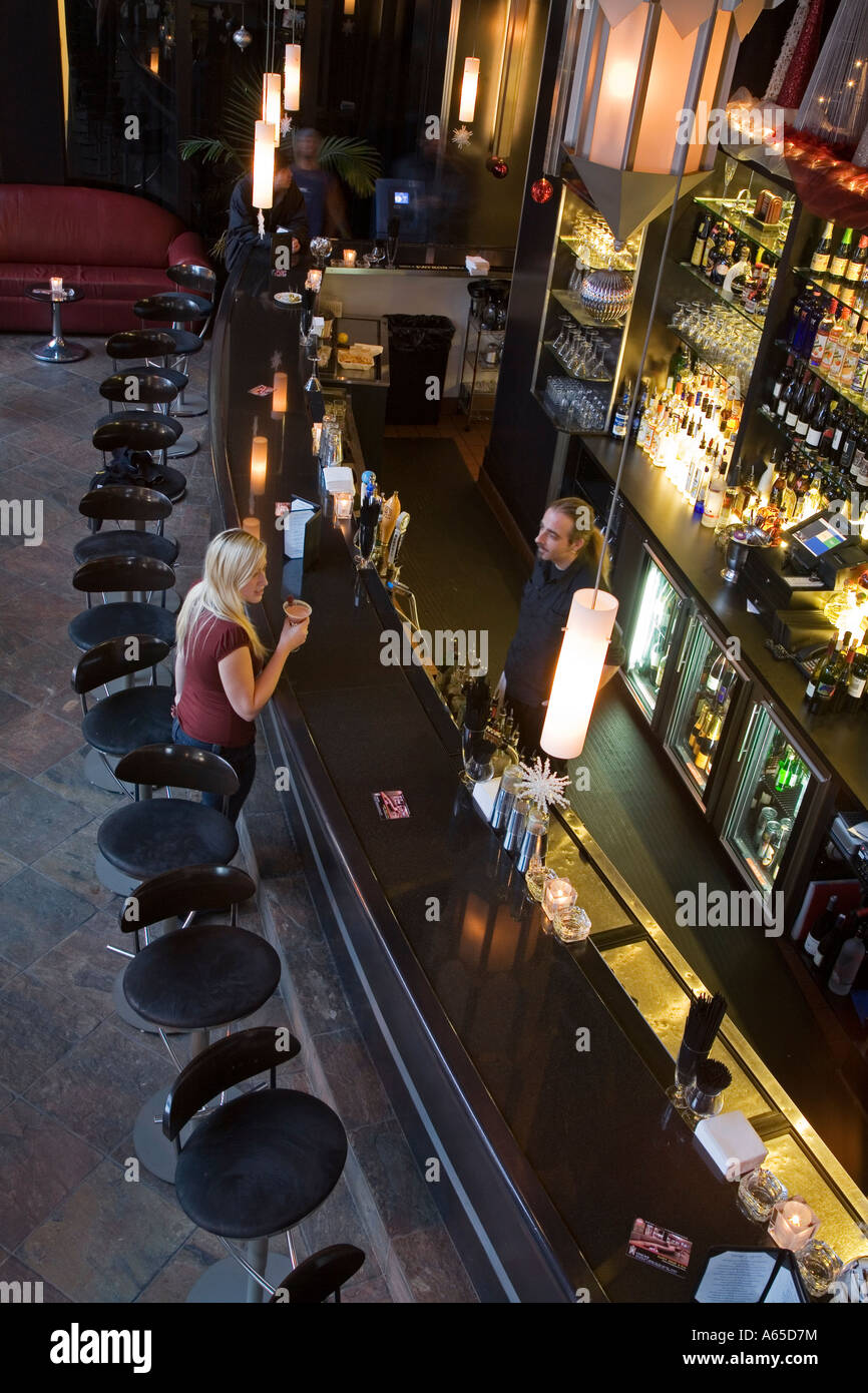 Detroit Michigan A young woman talks to the bartender at the Centaur ...
