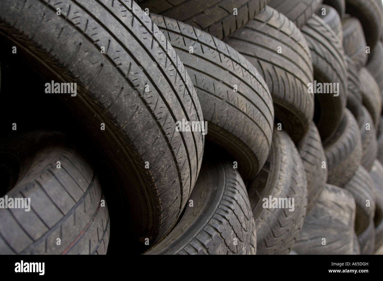 stack of old rubber car tyres awaiting recycling UK Stock Photo - Alamy