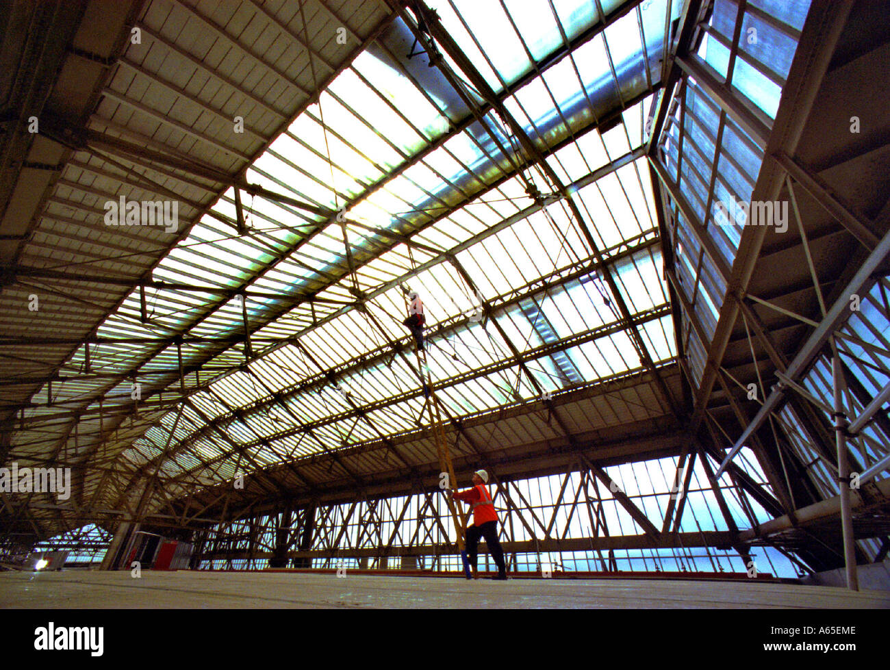 Scaffolders check the roof supports of the Waterloo Train Shed roof ...
