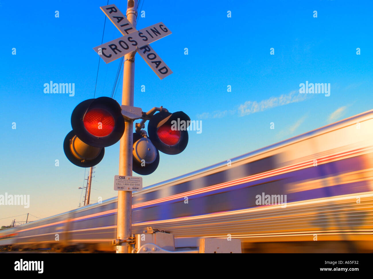 train speeds by traffic blinking warning sign Stock Photo - Alamy