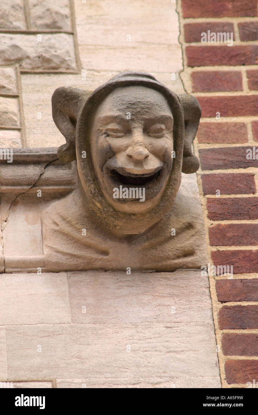 Grinning gargoyle in the shape of a Jester's face at Chichester ...