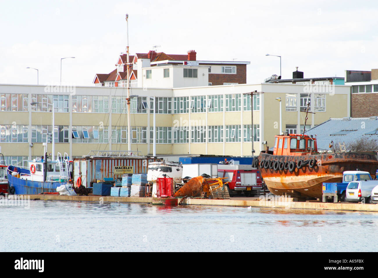 Shoreham Port Authority Offices with small commercial vessel DB Worker ...