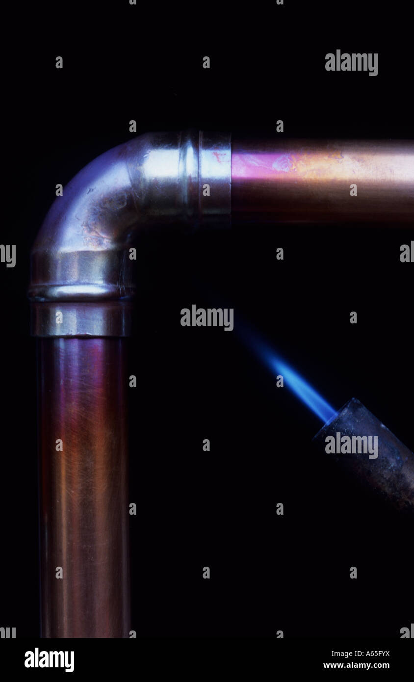 Copper Pipe And Elbow Being Heated Stock Photo - Alamy