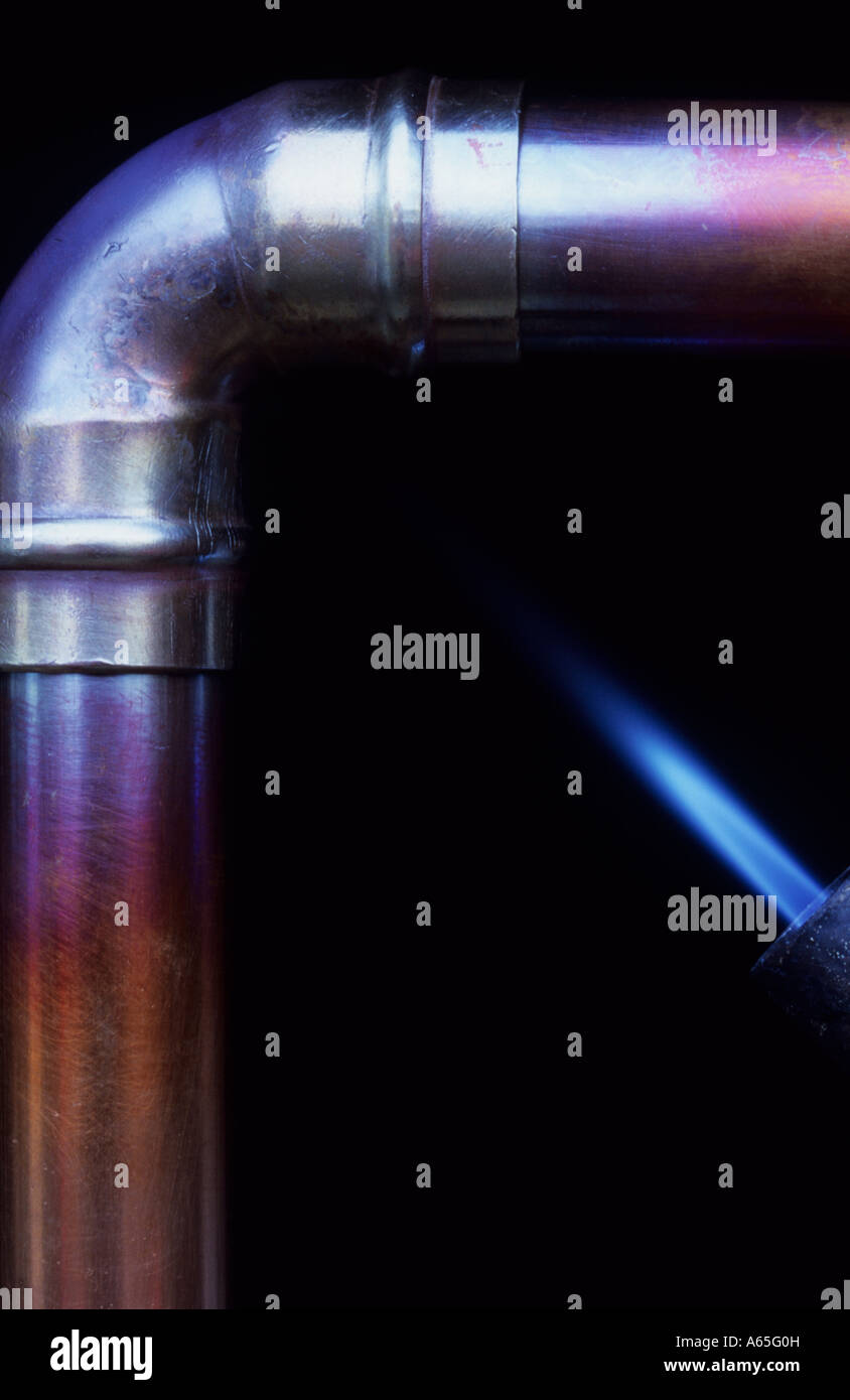 Copper Pipe And Elbow Being Heated Stock Photo - Alamy