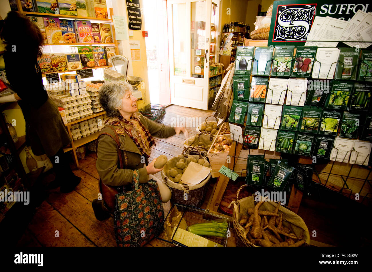 woman shopping for fresh local vegetables at TREEHOUSE fairtrade ...