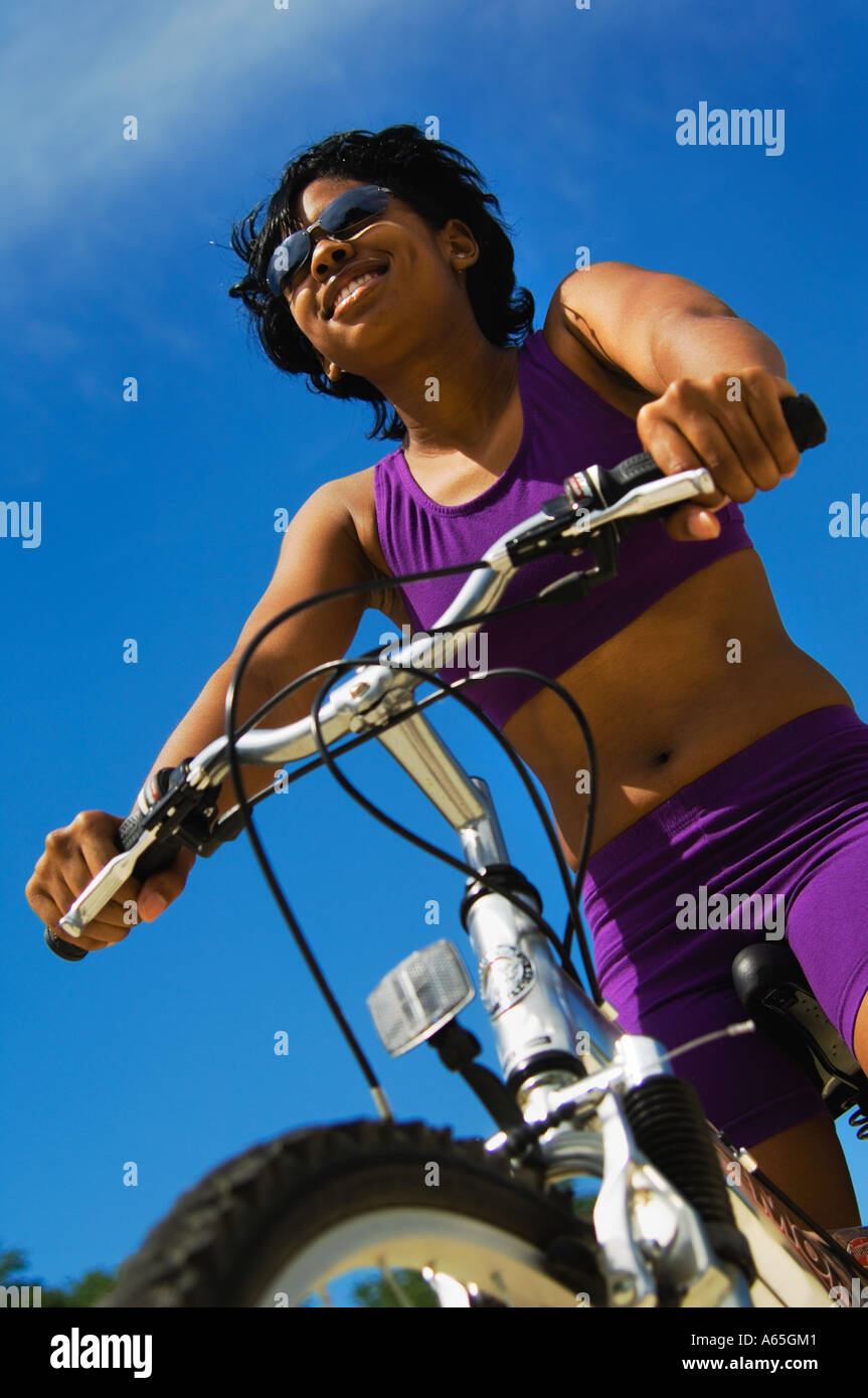 African American woman riding bike Stock Photo - Alamy