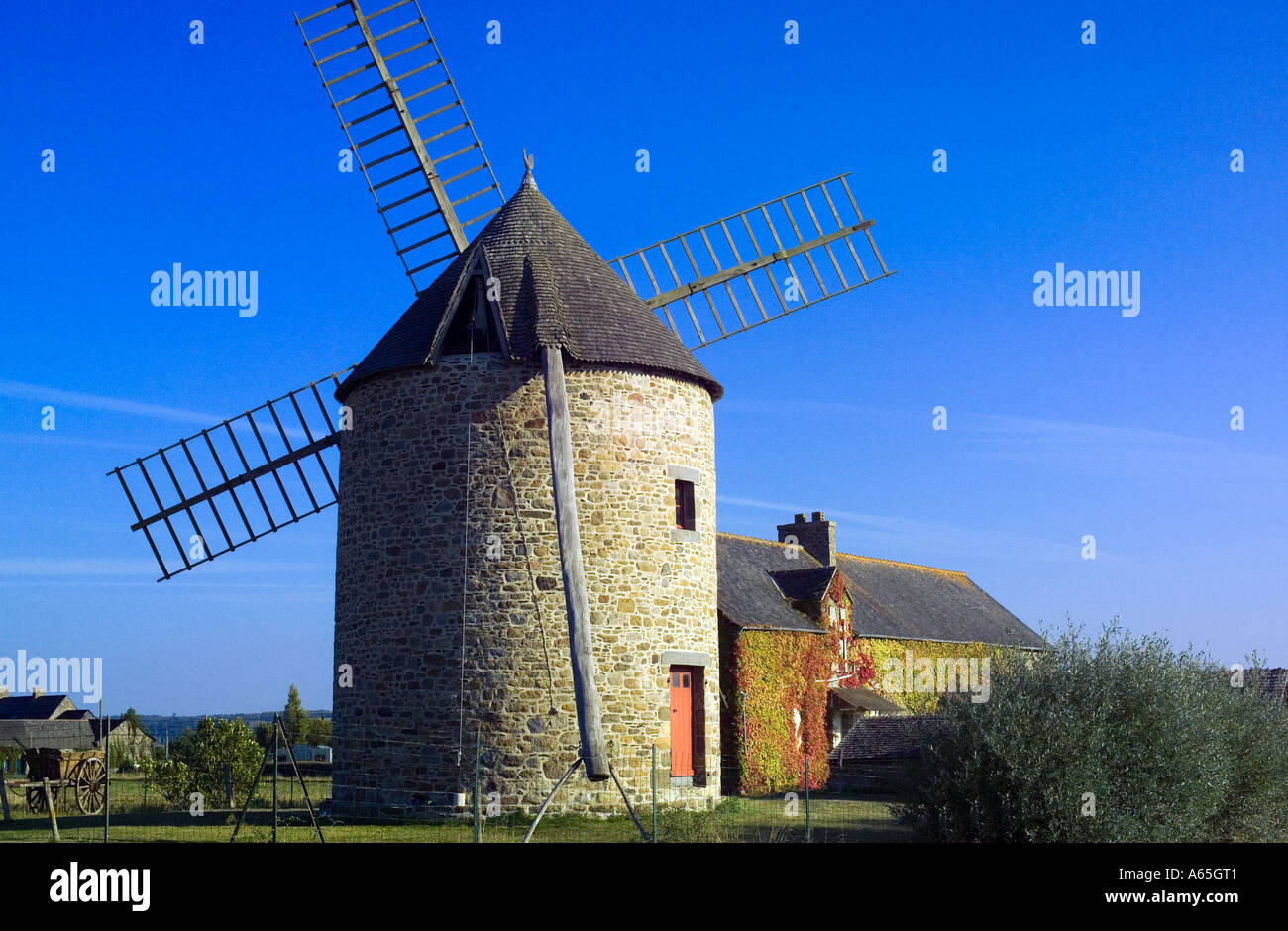 WINDMILL AND HOUSE WITH IVY CHERRUEIX BRITTANY FRANCE Stock Photo - Alamy