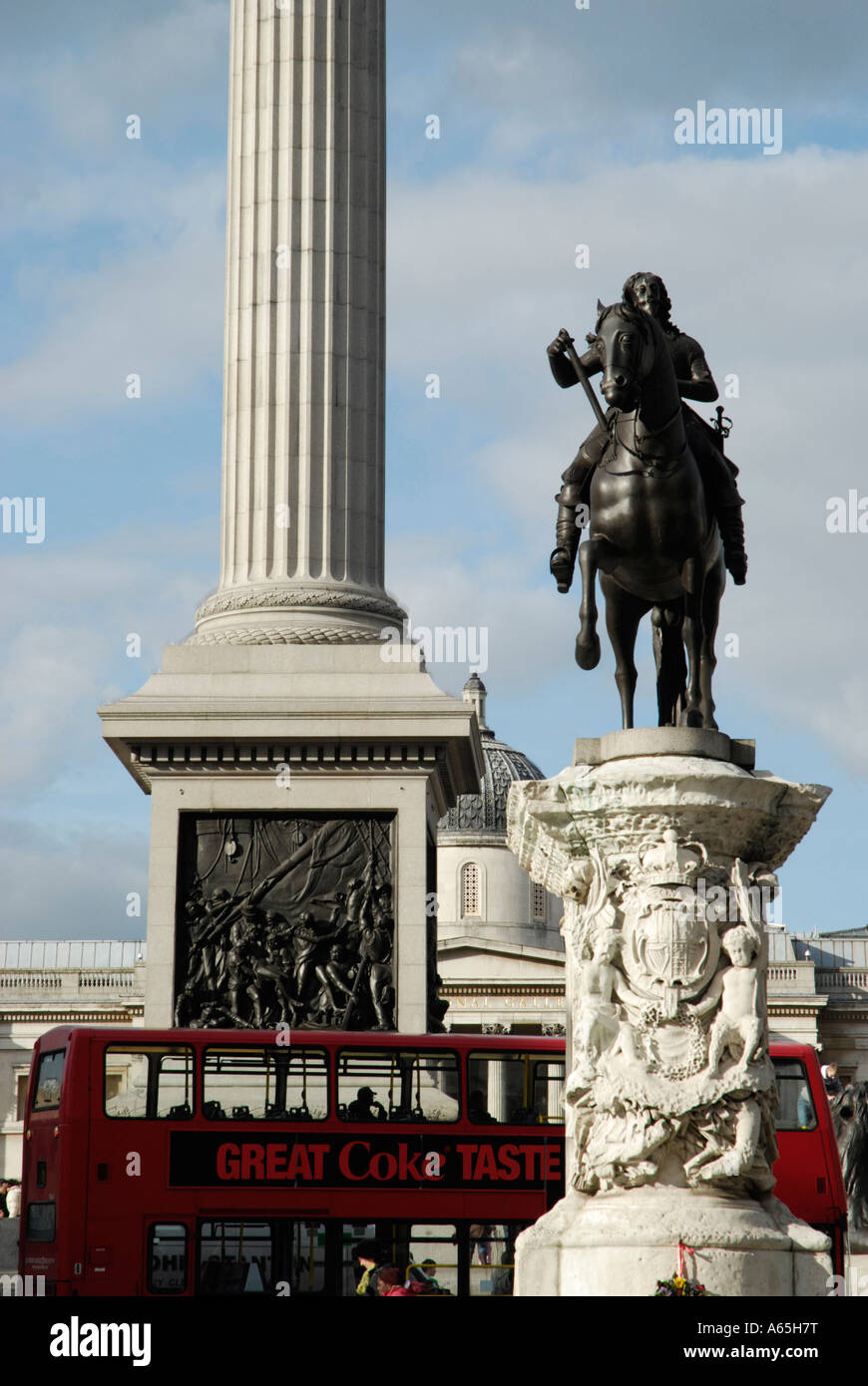 Statue of King Charles I red bus and Nelson's Column with the National ...