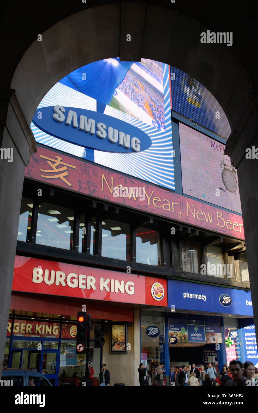 The famous colored advertising display in Piccadilly Circus framed by a ...
