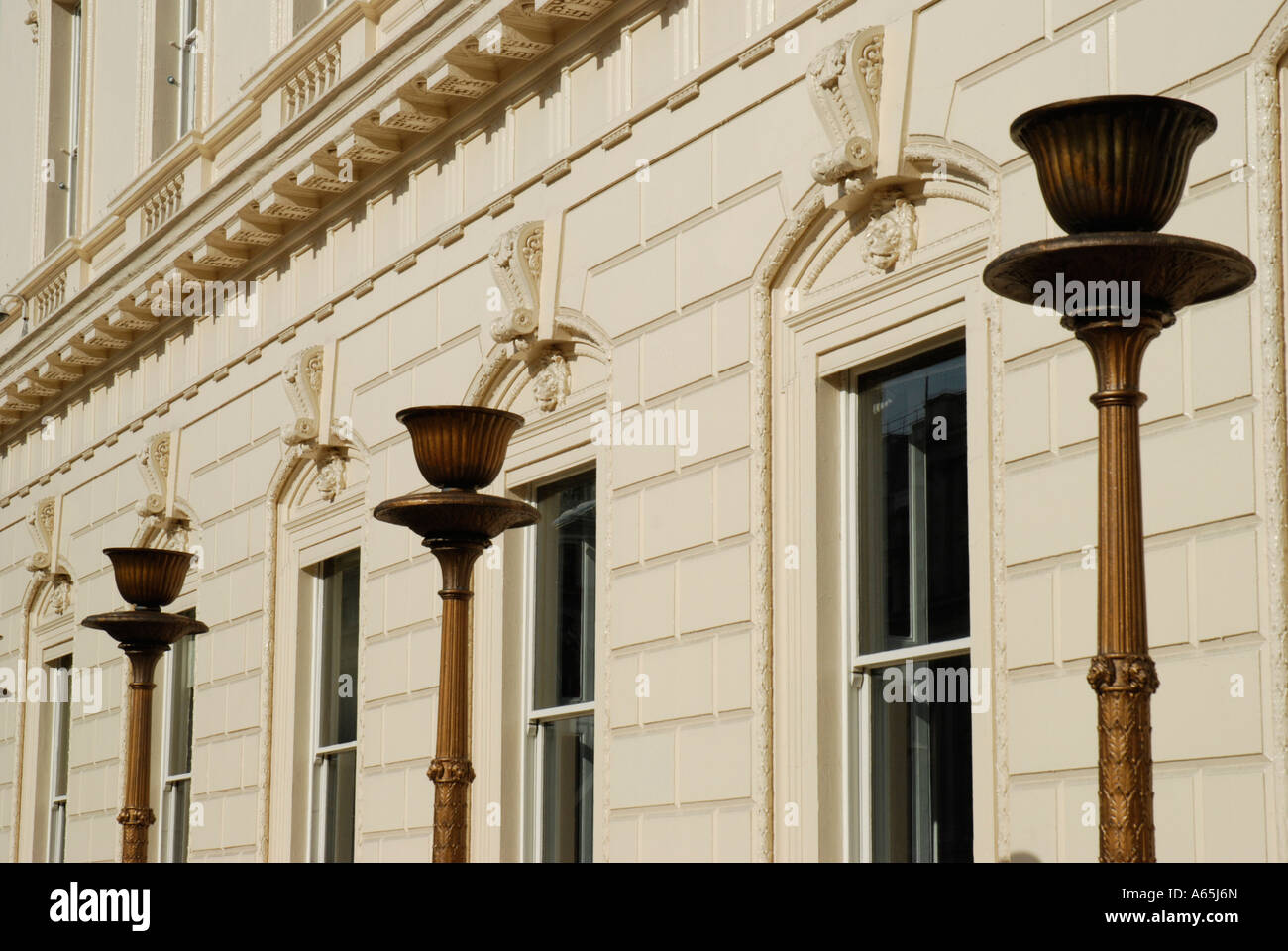Bronze flambeaux outside the Institute of Directors IOD building in ...