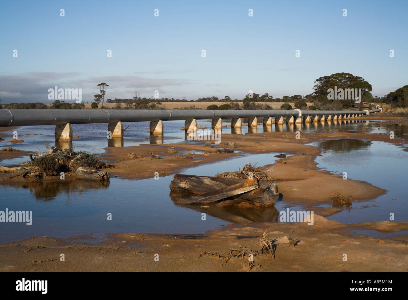 water pipeline running across a salt lake through outback Western Stock ...