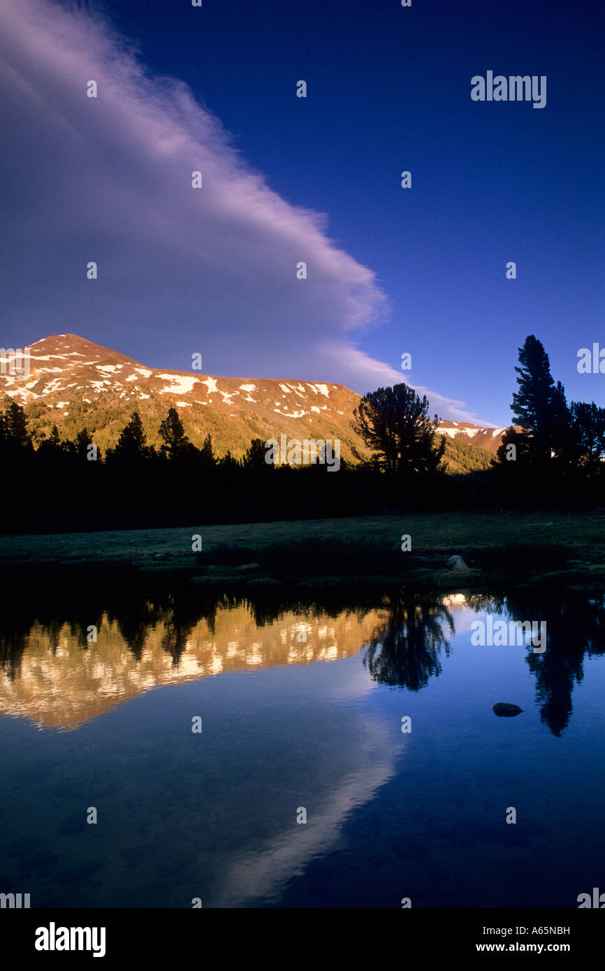 Lenticular wave cloud form over Mount Dana reflection alpine tarn pond ...