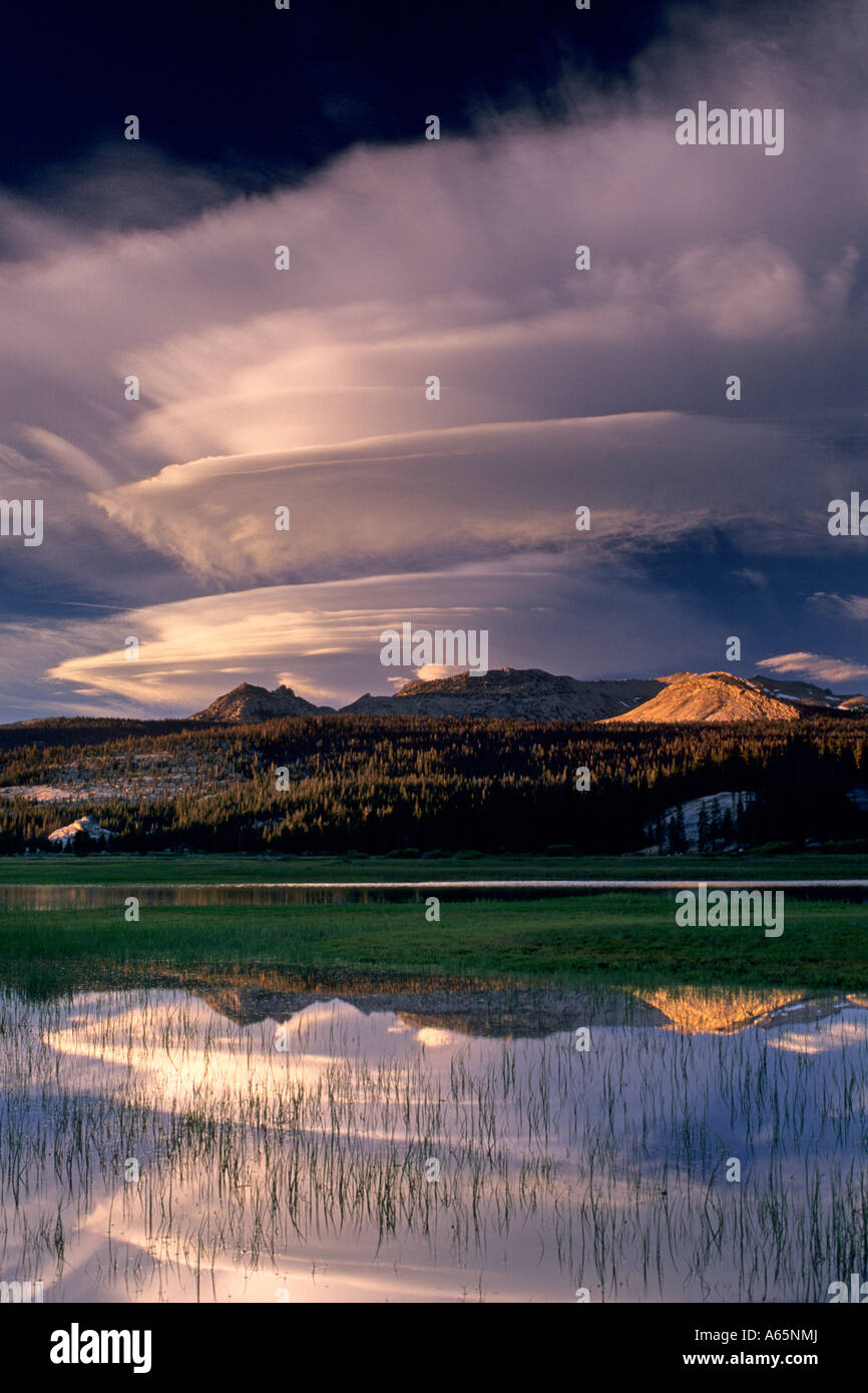 Lenticular cloud reflection sunset over Ragged Peak and Tuolumne ...