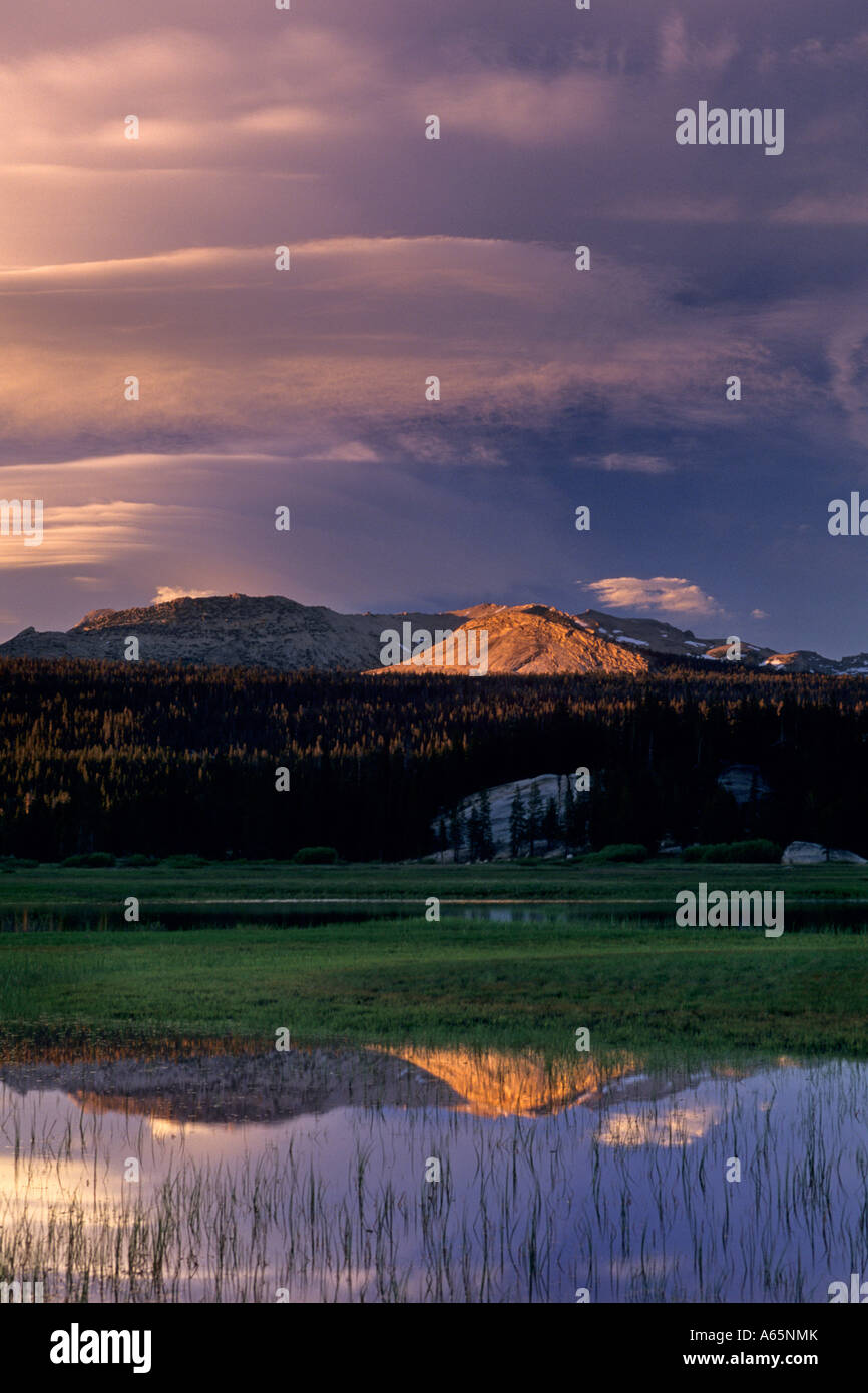 Lenticular cloud reflection sunset over Ragged Peak and Tuolumne ...