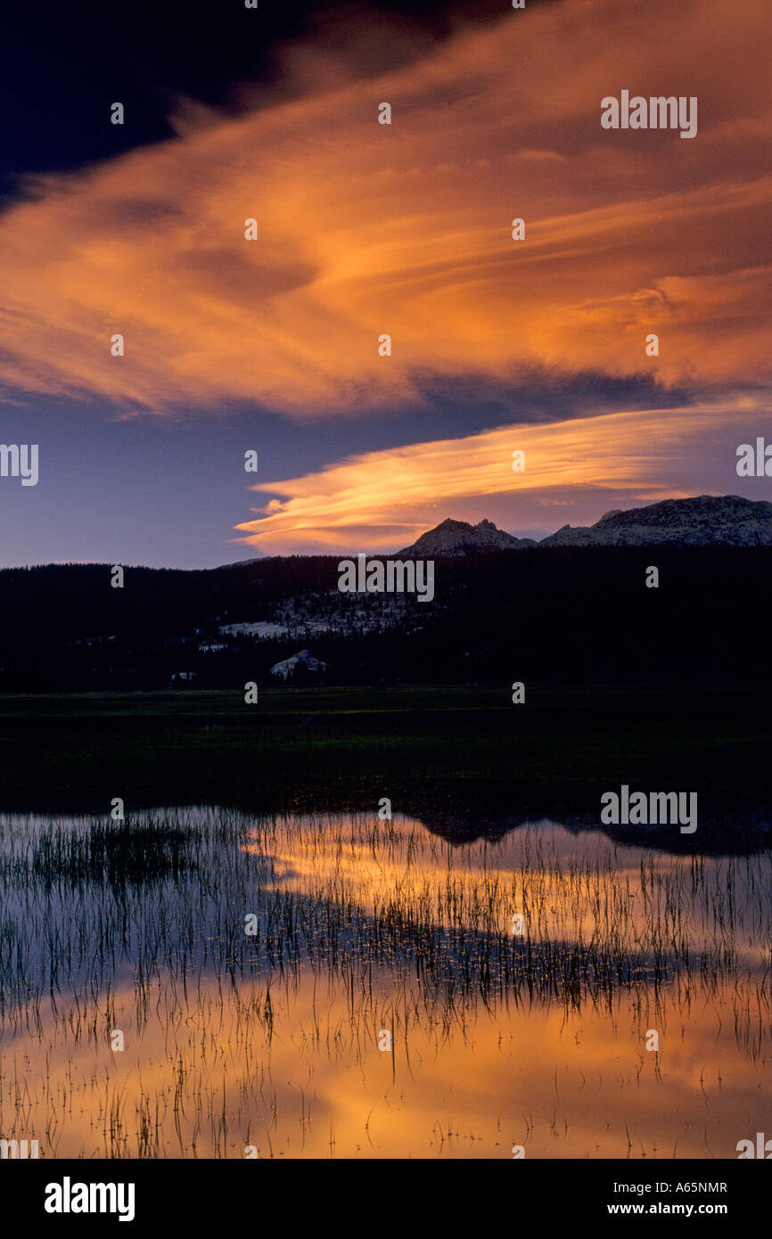 Lenticular cloud reflection sunset over Ragged Peak and Tuolumne ...