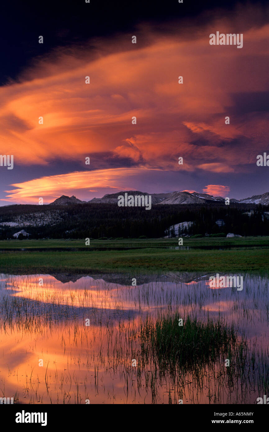 Lenticular cloud reflection sunset over Ragged Peak and Tuolumne ...