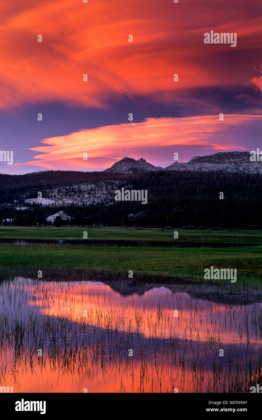 Lenticular cloud reflection sunset over Ragged Peak and Tuolumne ...
