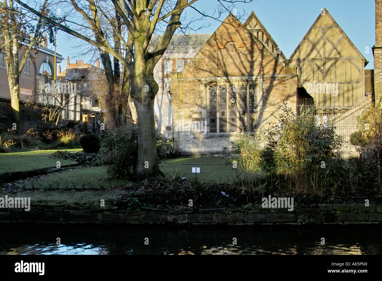 The Merchant Adventurers Hall on the banks of the river Foss York Stock ...