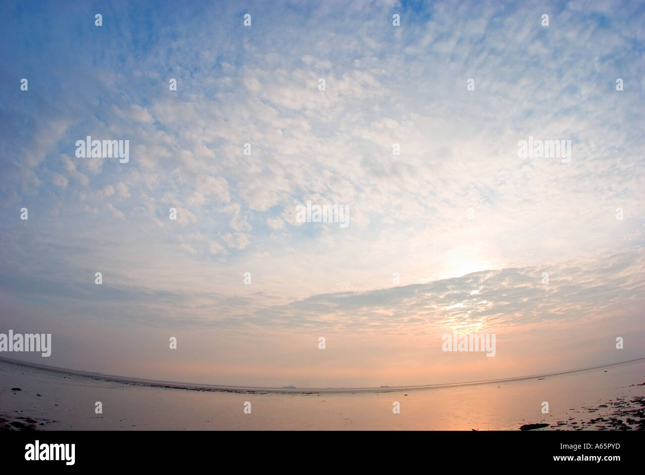 Sunset over the sea with a fisheye lens Stock Photo - Alamy
