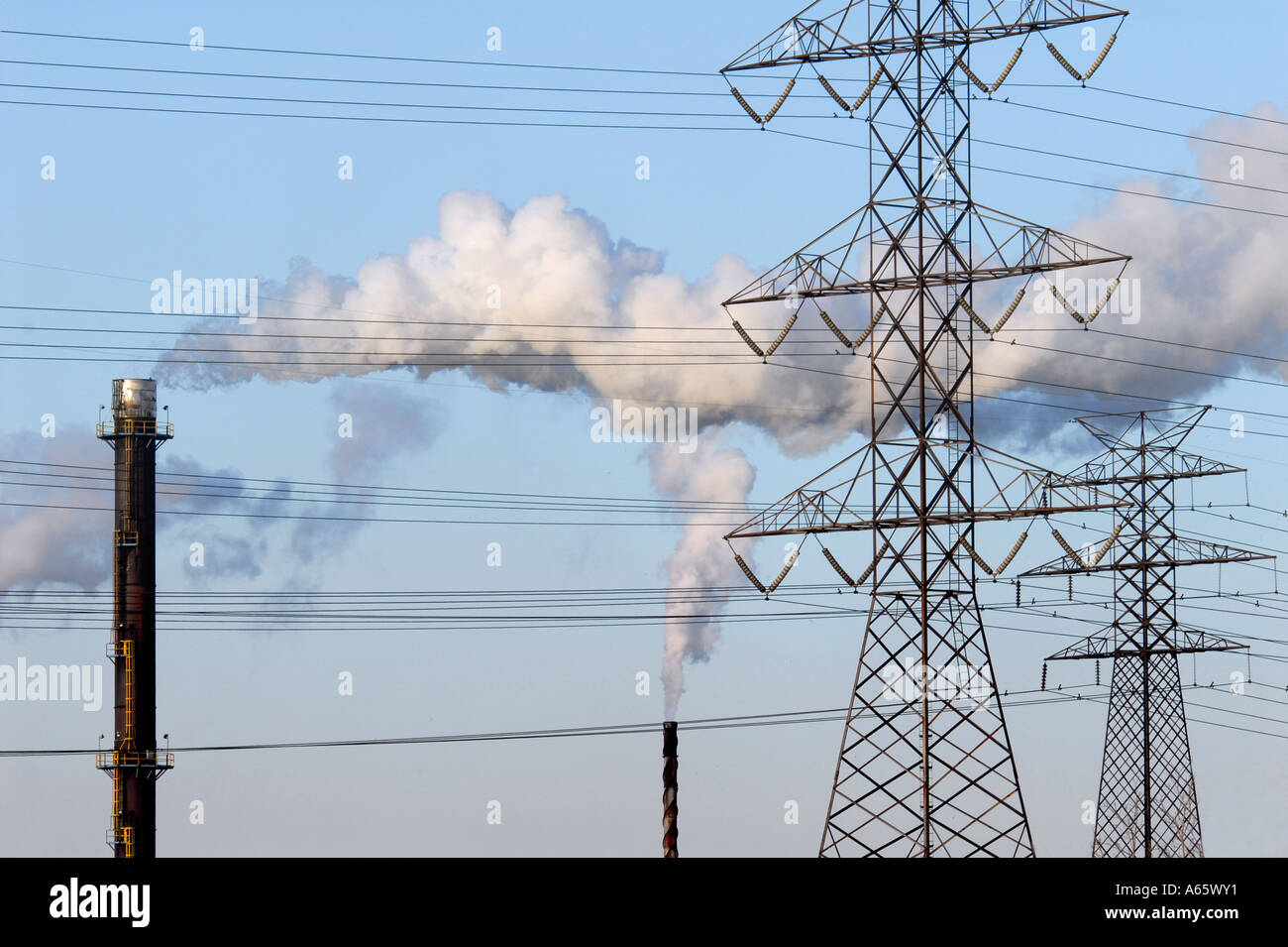 Hydro power lines and industry Stock Photo - Alamy