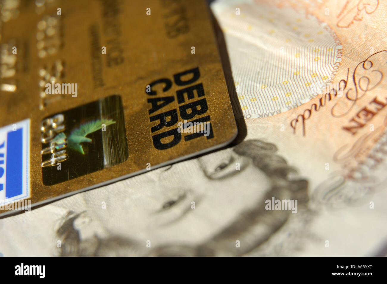 Debit card on ten pound note Stock Photo - Alamy