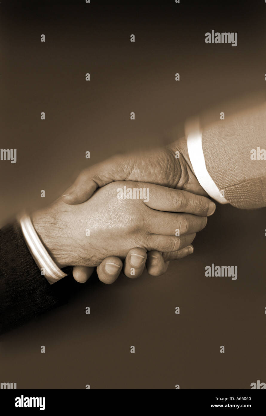 Handshake between two men Stock Photo - Alamy