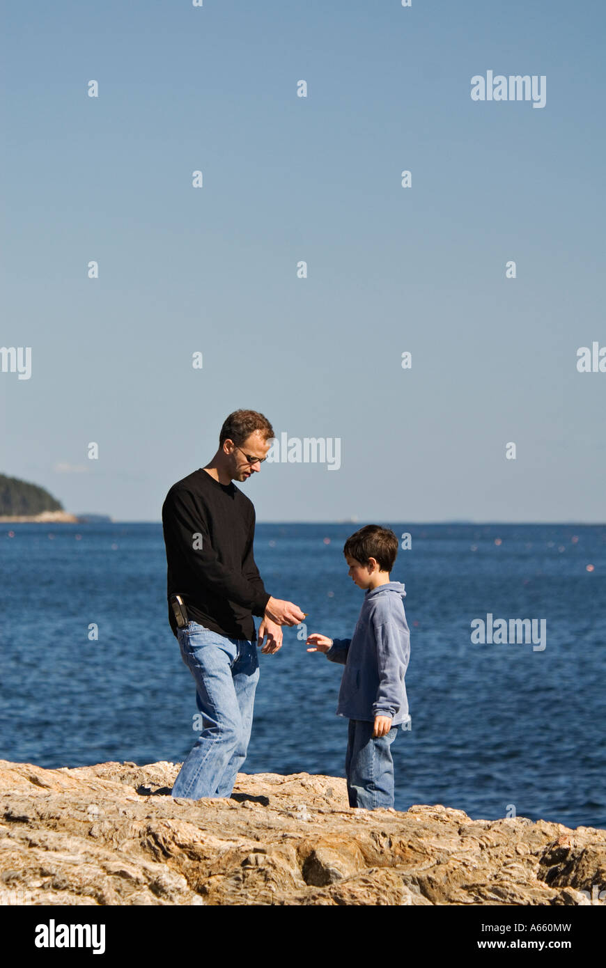Man and Child Exploring Rugged Coastline Marshall Point Maine Stock ...