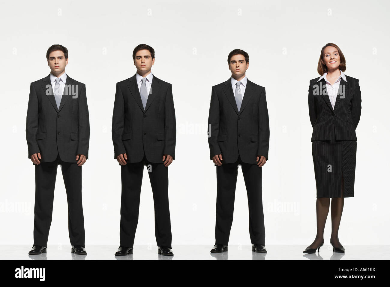 Businesspeople standing side by side, arms by side, behind back Stock ...