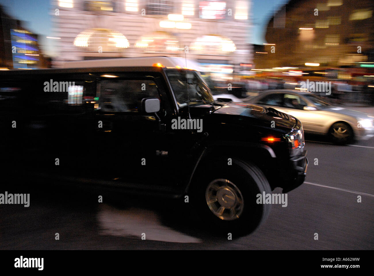 Stretched Hummer at night in Piccadilly Circus London Stock Photo - Alamy