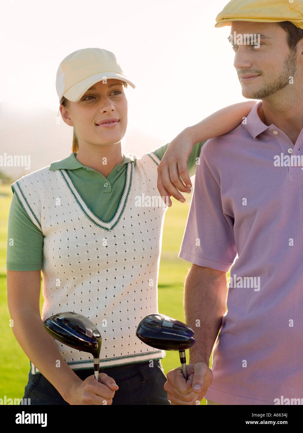 Two young golfers on court Stock Photo - Alamy