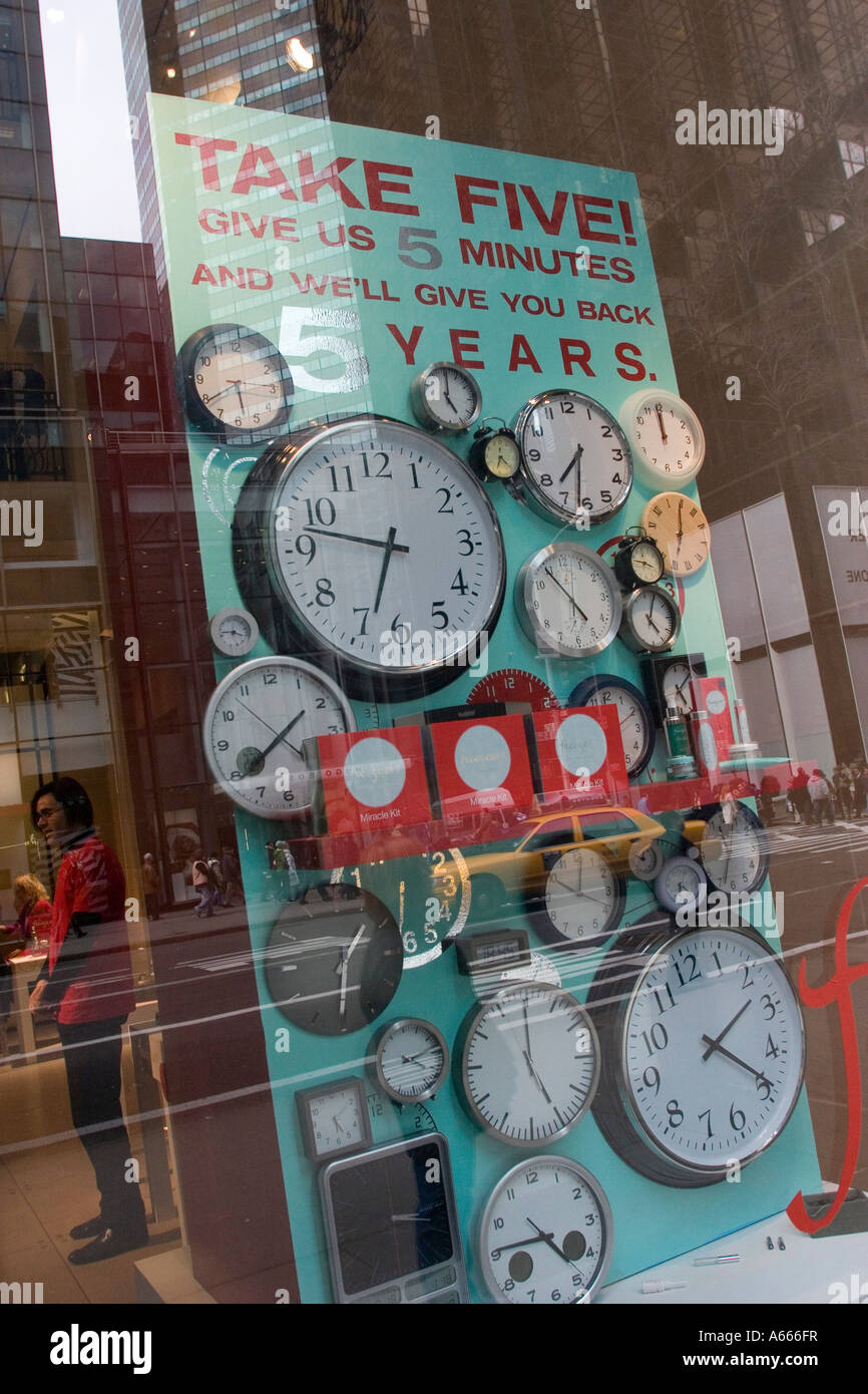 Window display of clocks in Fifth Avenue Store New York City NYC NY USA ...