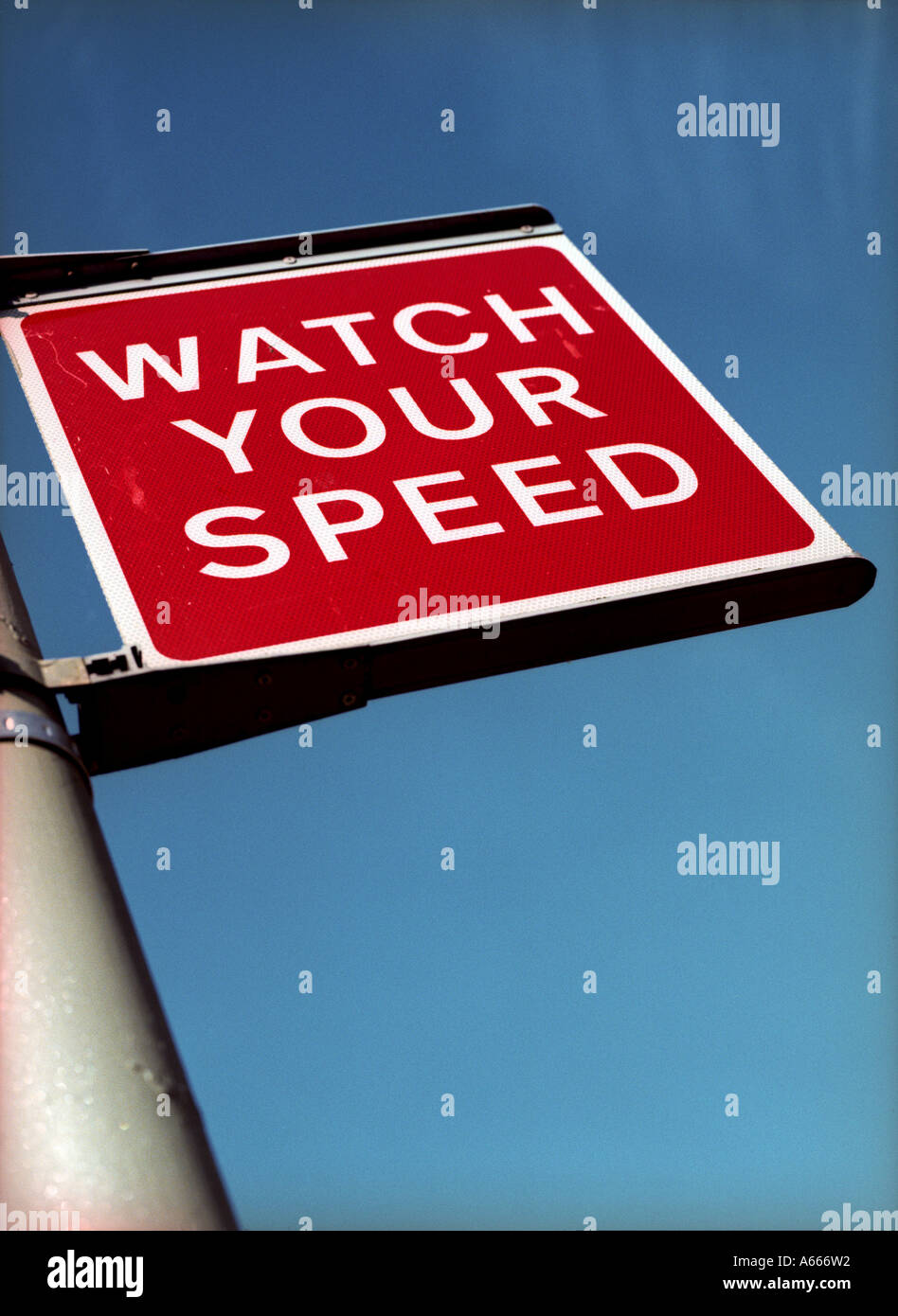 A red sign reading Watch your speed Stock Photo - Alamy