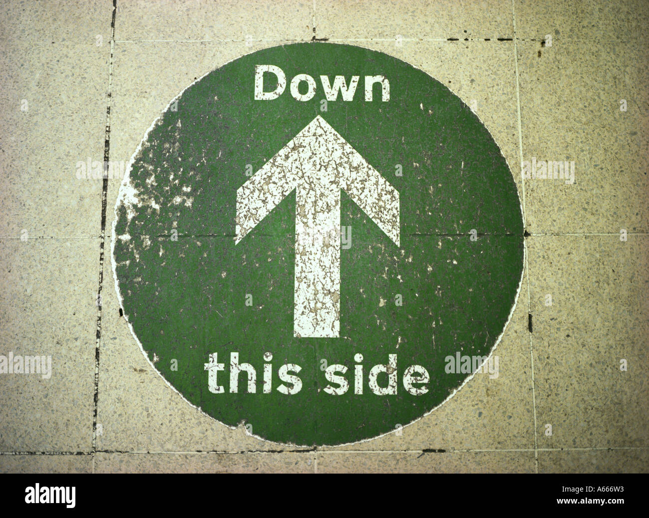 A green sign reading Down this side Stock Photo - Alamy