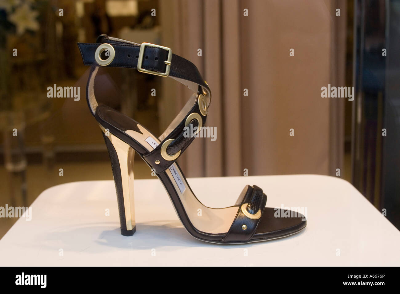 Designer shoe on display in shop window in Bond Street London GB UK ...