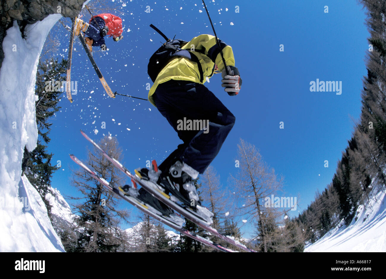 Skiers jumping off cliff Fish Eye Stock Photo - Alamy